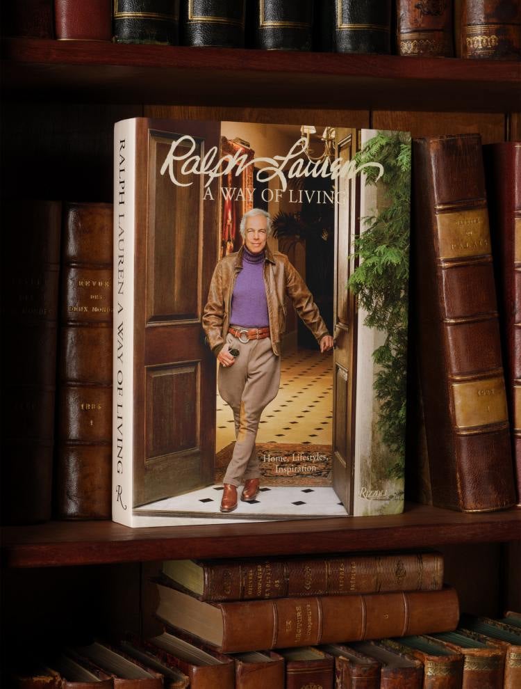 Ralph on cover of A Way of Living book on a bookshelf.